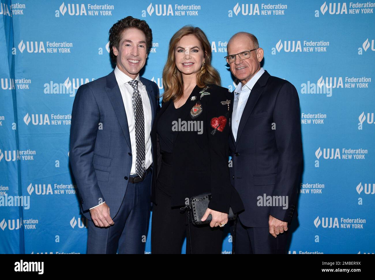 Pastors Joel Osteen, from left, and Victoria Osteen pose with honoree ...