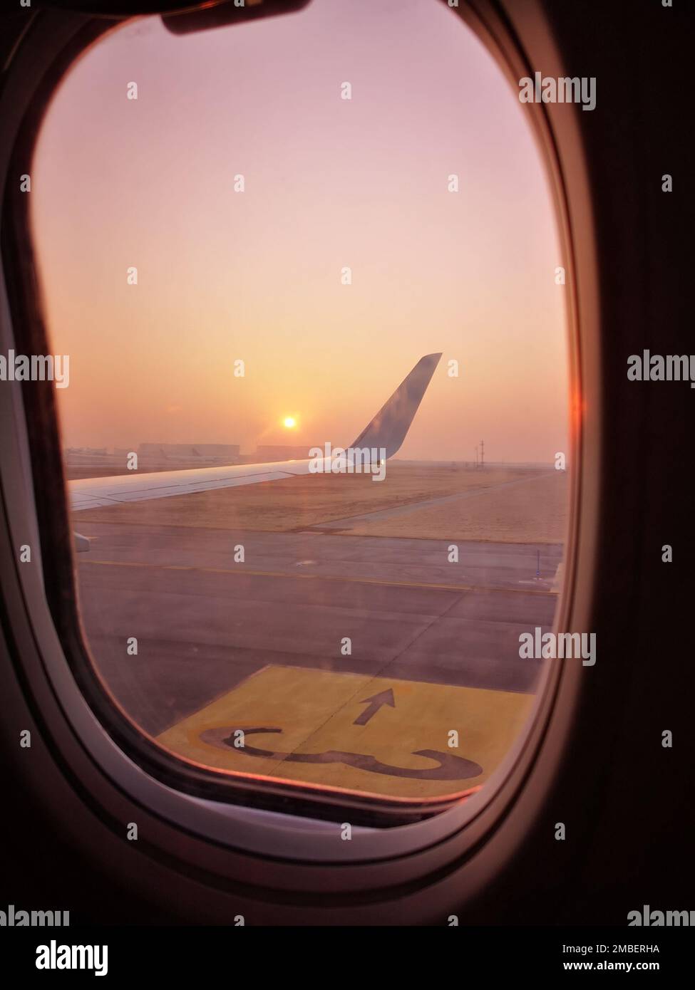 a sunrise shot out of an airplane window Stock Photo - Alamy