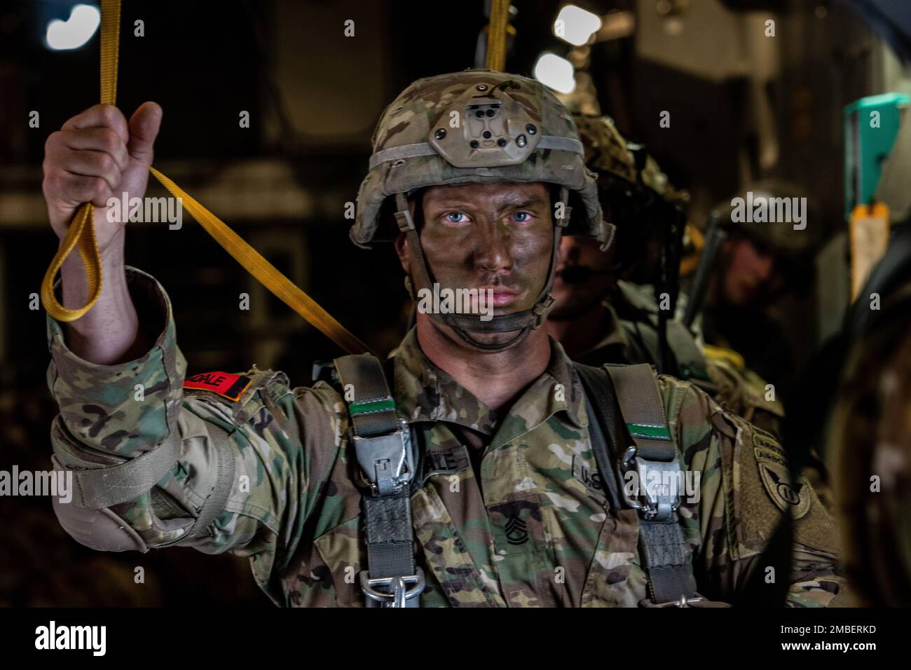 U.S. Army Sgt. 1st Class Charlie Arrendale holds his static-line in the ...