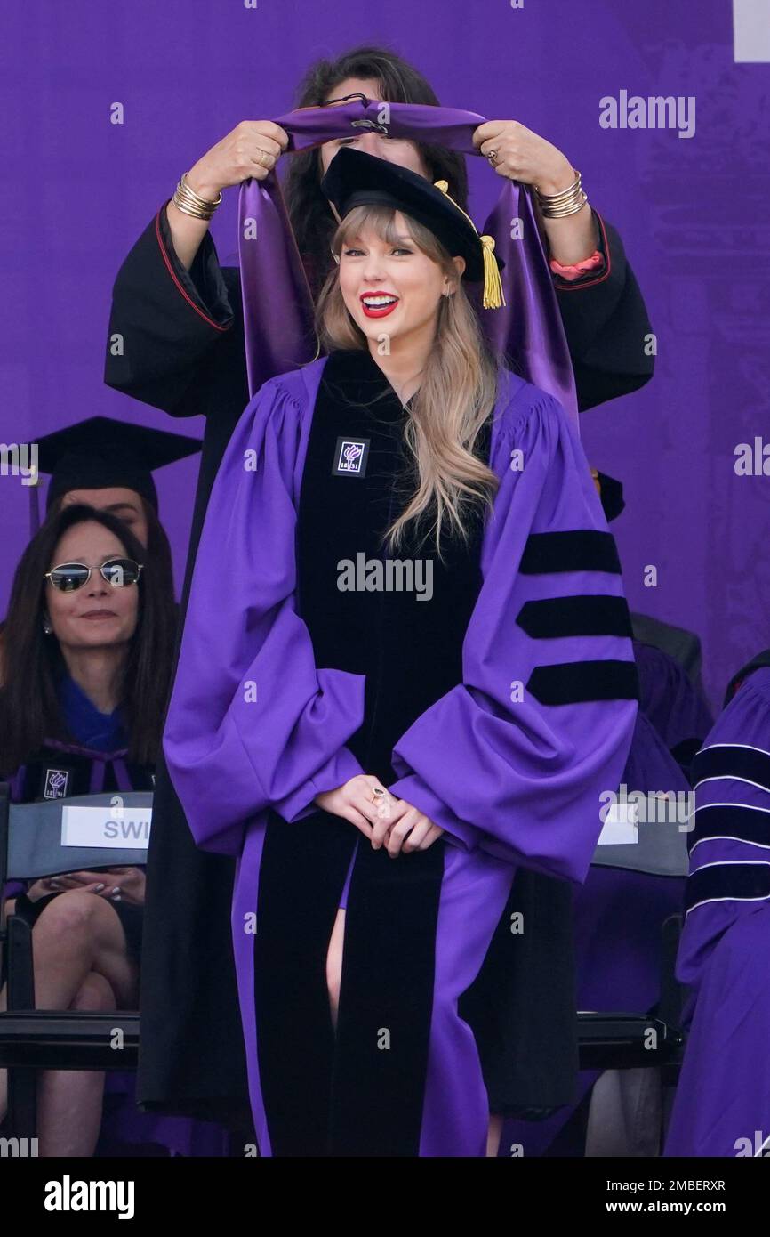Taylor Swift receives an honorary degree during a graduation ceremony ...