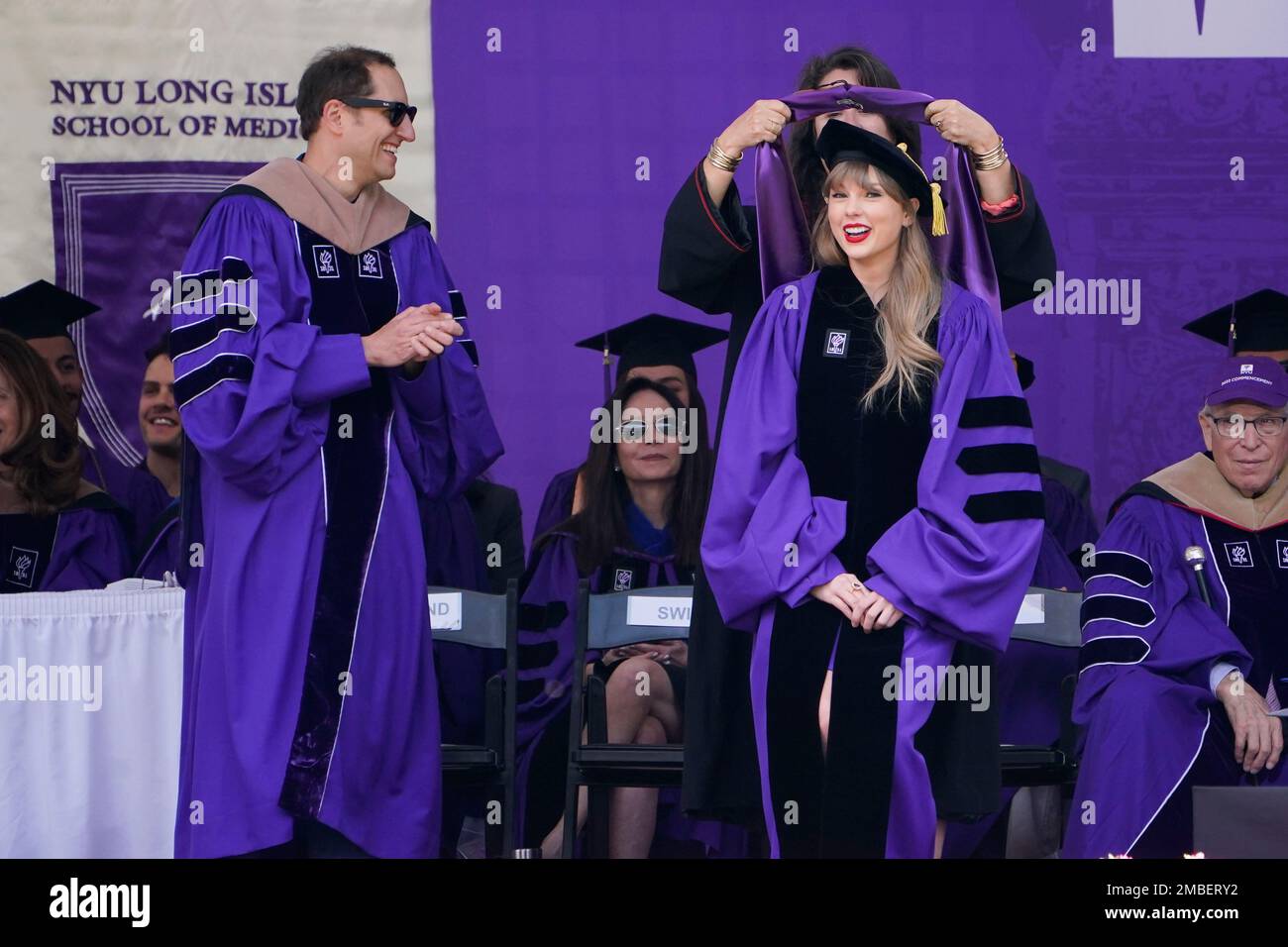 Taylor Swift, right, receives an honorary degree during a graduation ...