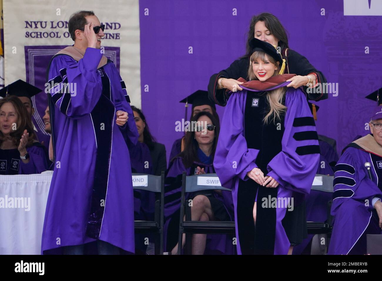 Taylor Swift, right, receives an honorary degree during a graduation ...