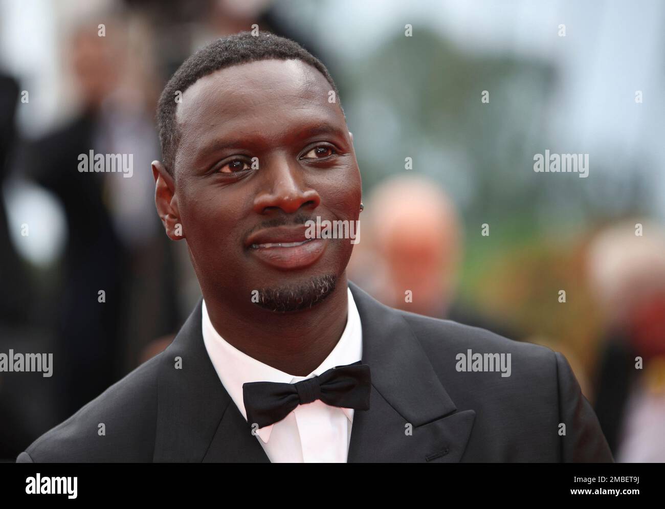 Omar Sy poses for photographers upon arrival at the premiere of the ...