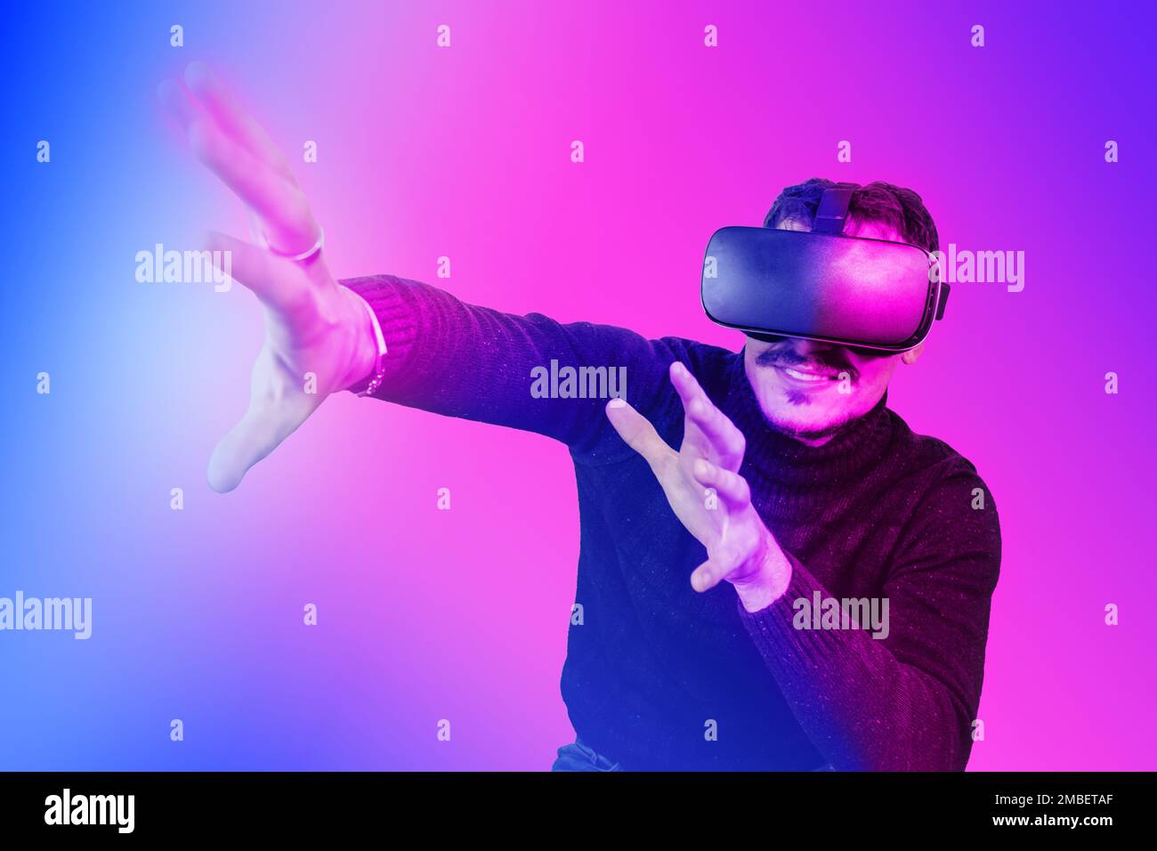 Young man is using virtual reality viewer. Modern man portrait with ...