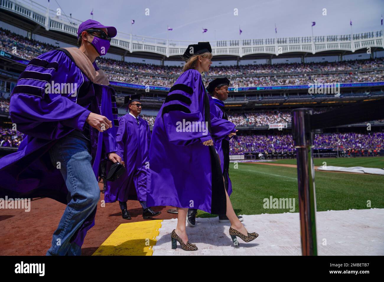 Taylor Swift, second from right, participates in a graduation ceremony ...