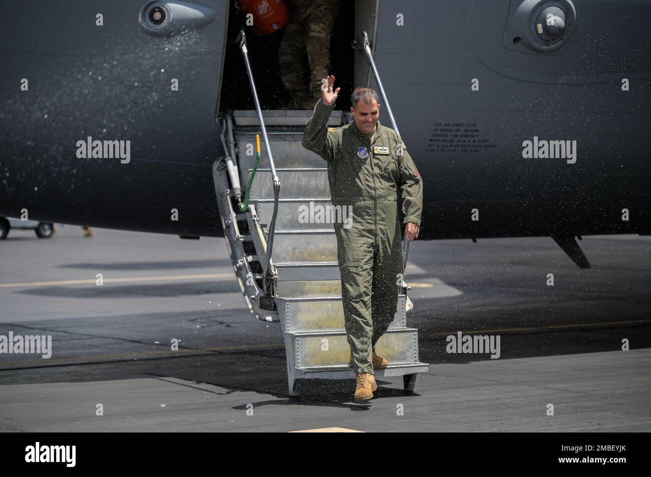 Col. Daniel Dobbels, 15th Wing commander, steps off a C-17 Globemaster ...
