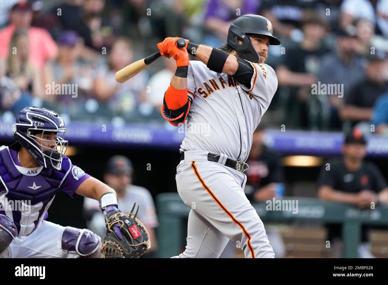 San Francisco Giants' Brandon Crawford follows the flight of his triple ...