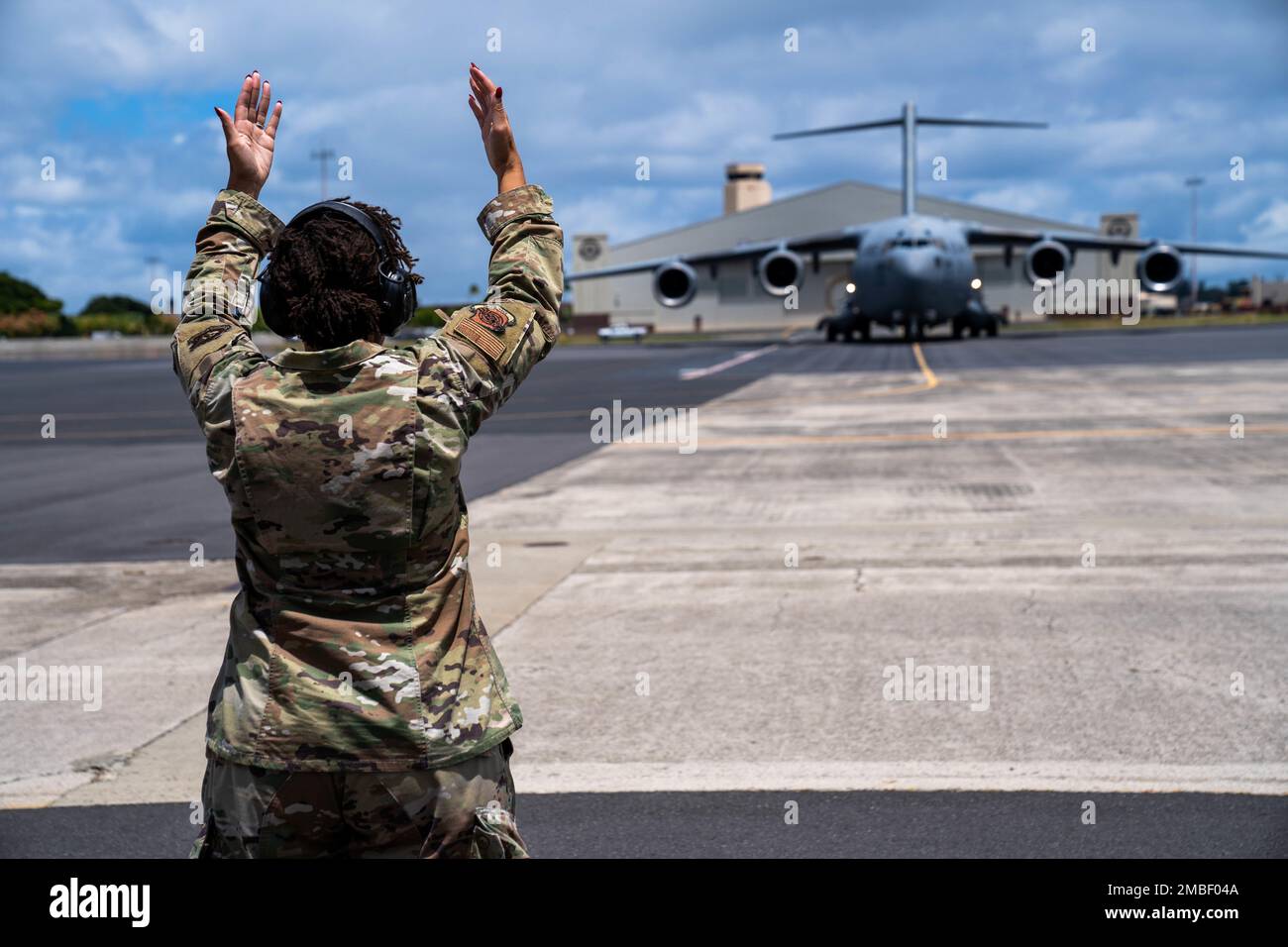 Chief Master Sgt. Sheronne King, 15th Wing command chief, marshals a C ...