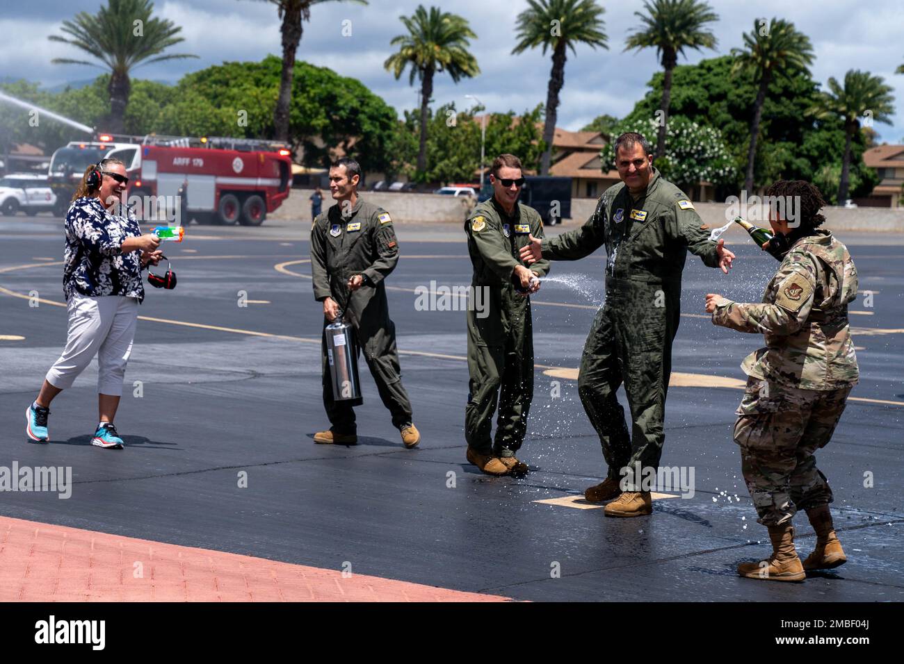 Col. Daniel Dobbels, 15th Wing commander, celebrates with his family ...