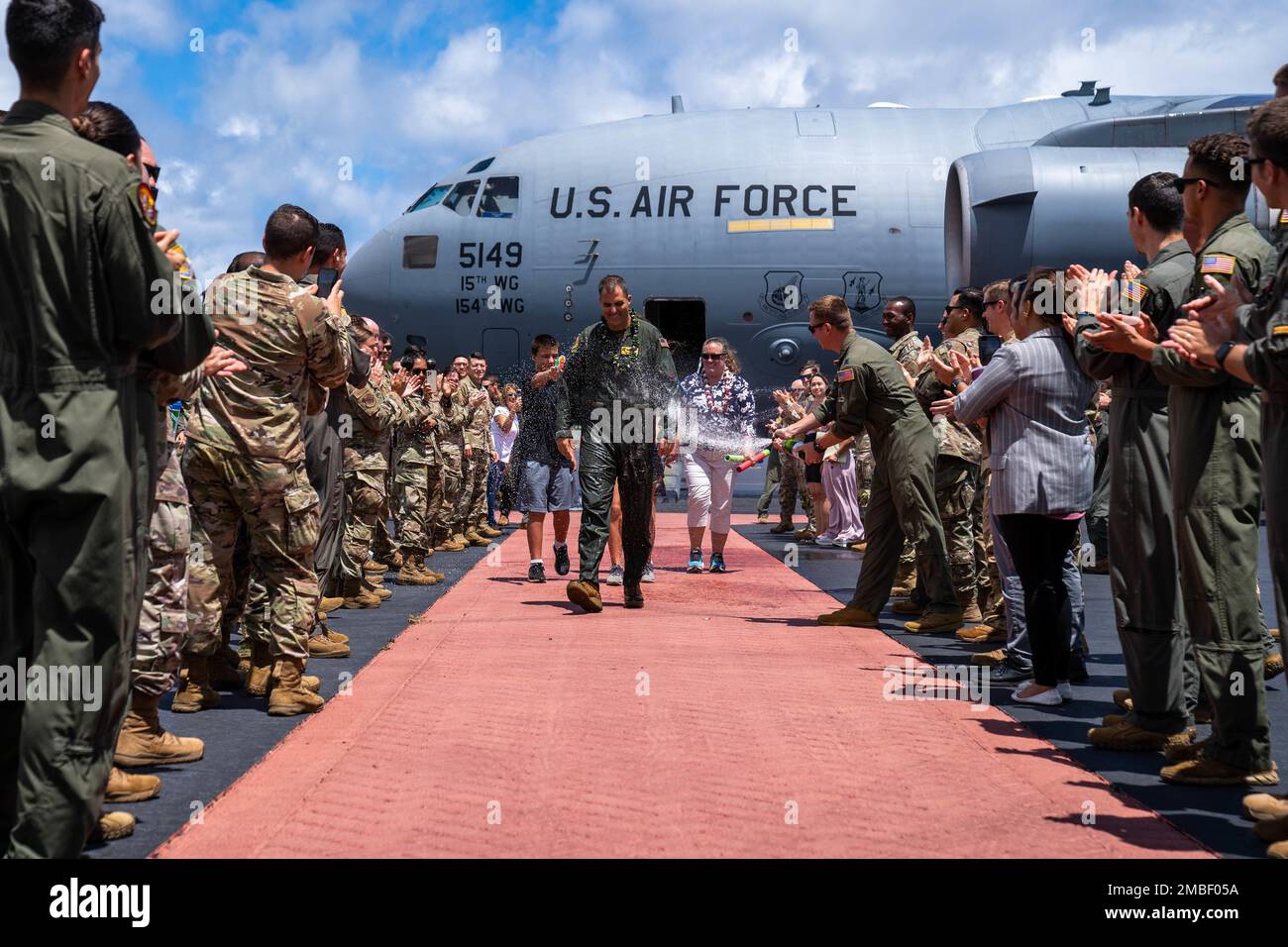 Col. Daniel Dobbels, 15th Wing commander, celebrates with his family ...