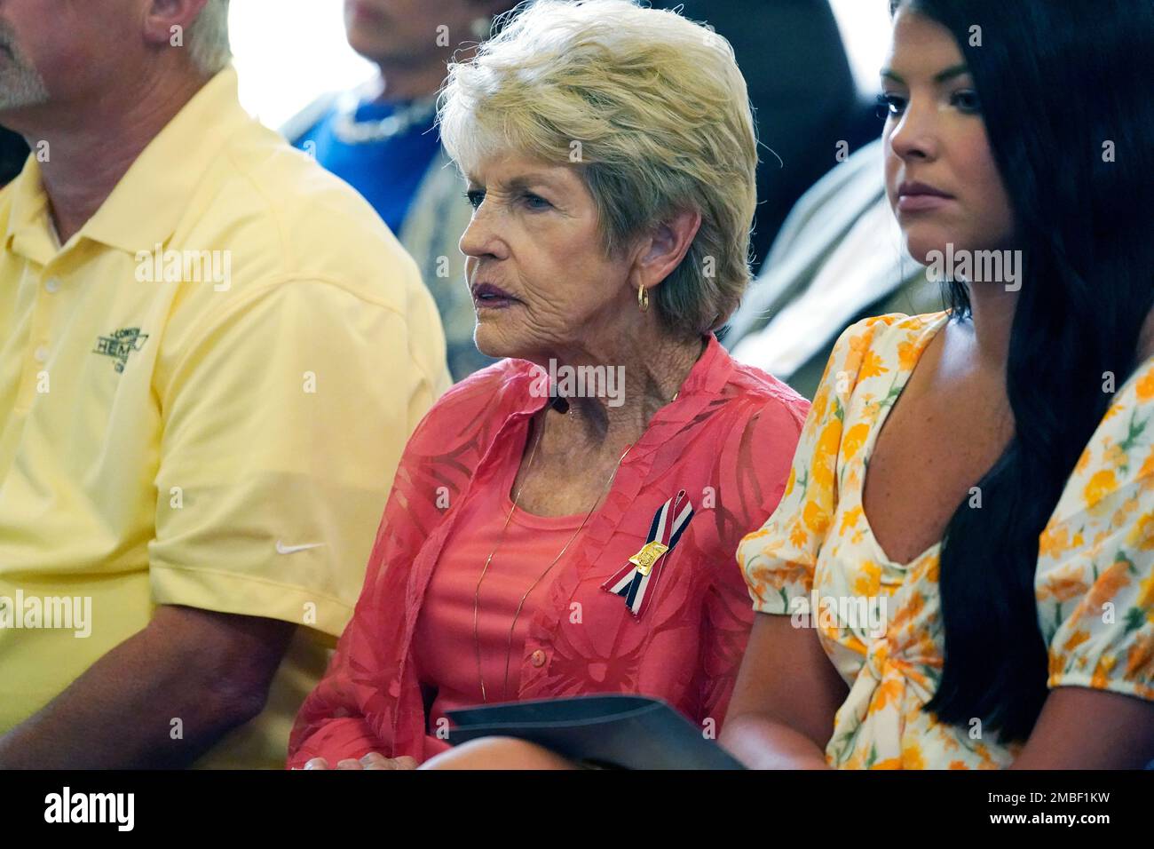 Brenda Langham, center, wears a police memorial ribbon and Mississippi ...