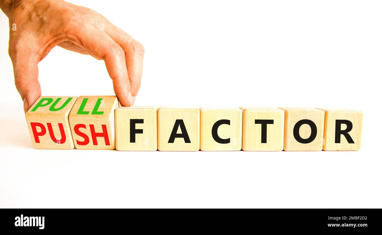 Pull or push factor symbol. Concept word Pull factor and Push factor on wooden cubes. Beautiful ...