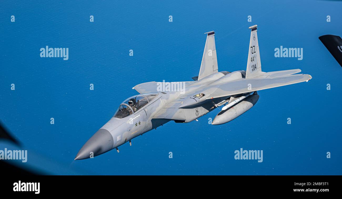 A 44th Fighter Squadron F-15C Eagle departs a 909th Air Refueling Squadron KC-135 Stratotanker ...