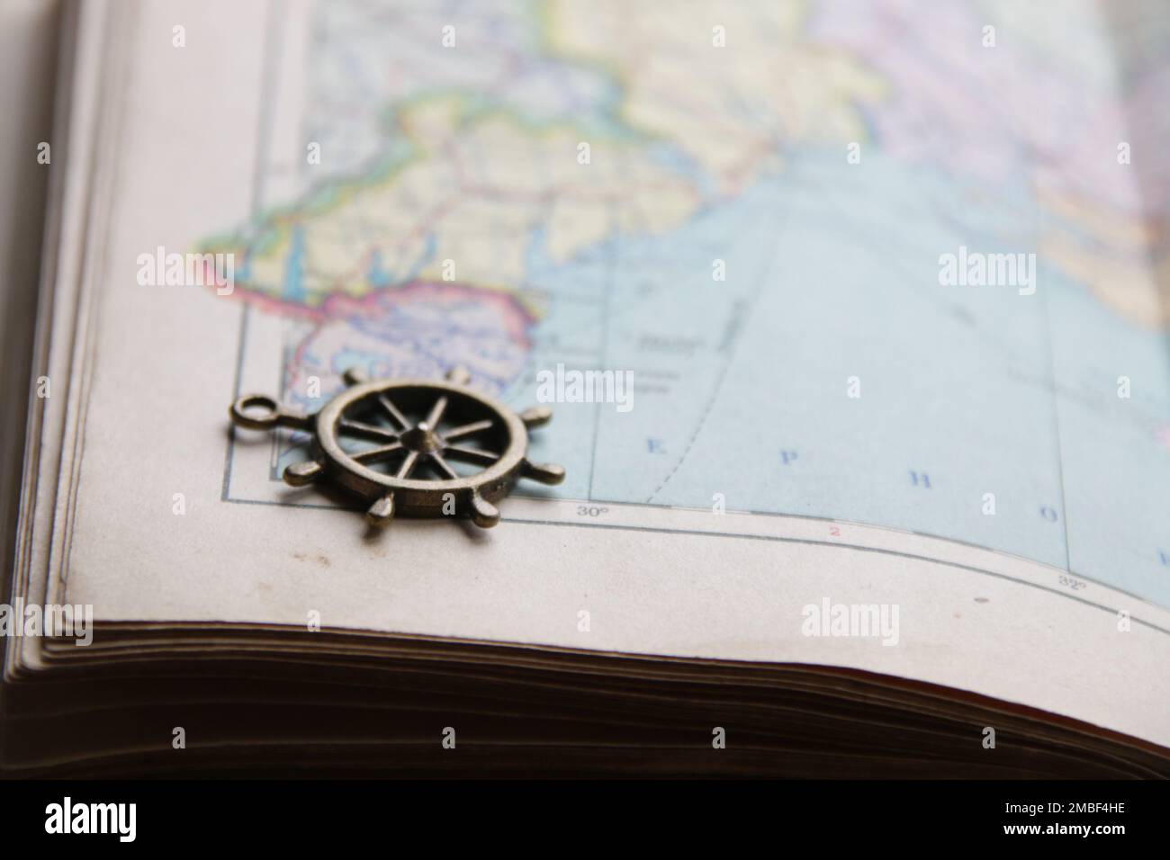 Ship's helm on the map. Summer vacation creative concept Stock Photo ...