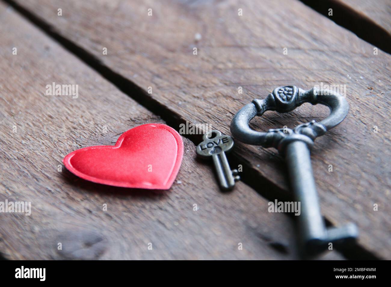 Love key idea. Key with the heart as a symbol of love Stock Photo - Alamy
