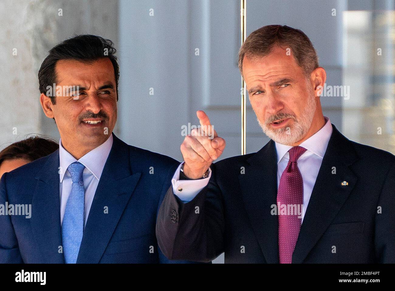 The Emir of Qatar Sheikh Tamim bin Hamad Al Thani, left, listens to ...
