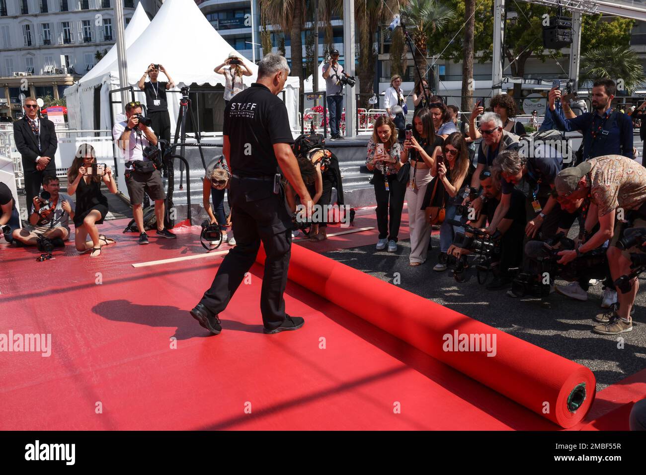 Crew members install the red carpet at the Palais des Festivals on ...