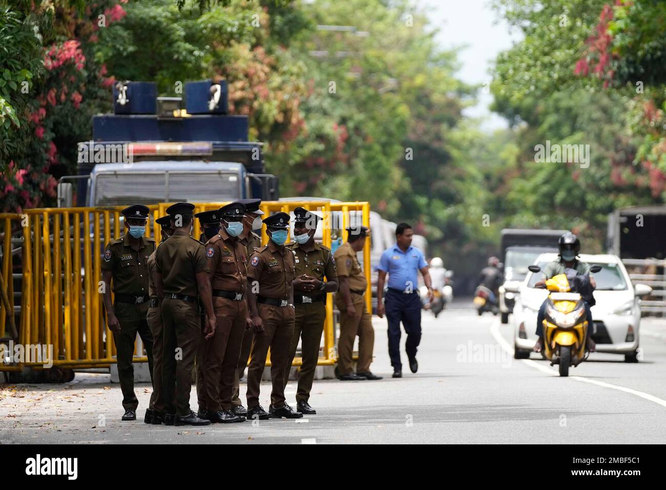 Police officers man a barricade at the entrance to the Sri Lankan ...