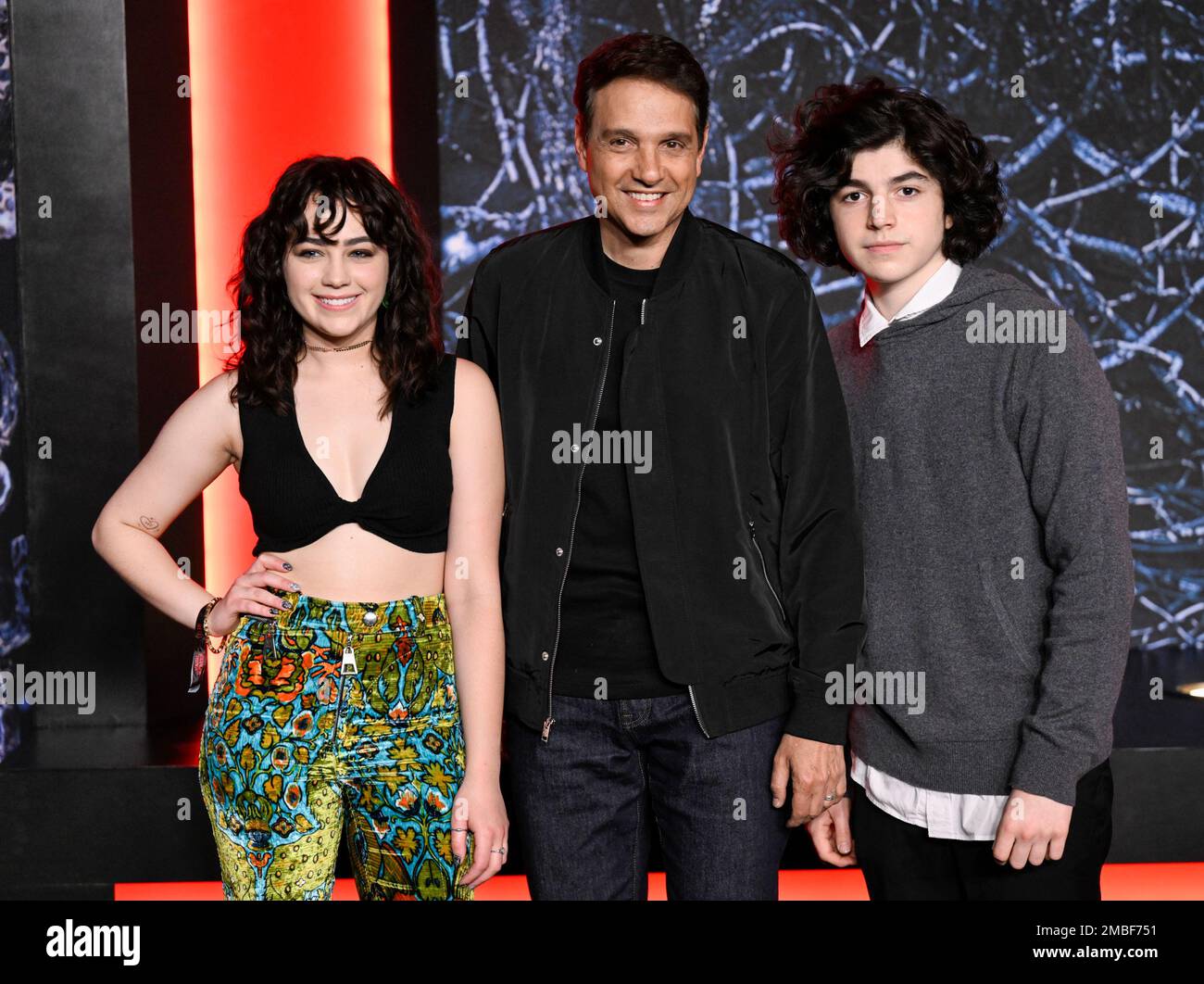 Mary Mouser, left, and Ralph Macchio and Griffin Santopietro attend the ...
