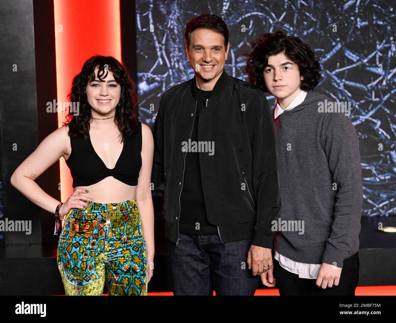 Mary Mouser, left, and Ralph Macchio and Griffin Santopietro attend the ...