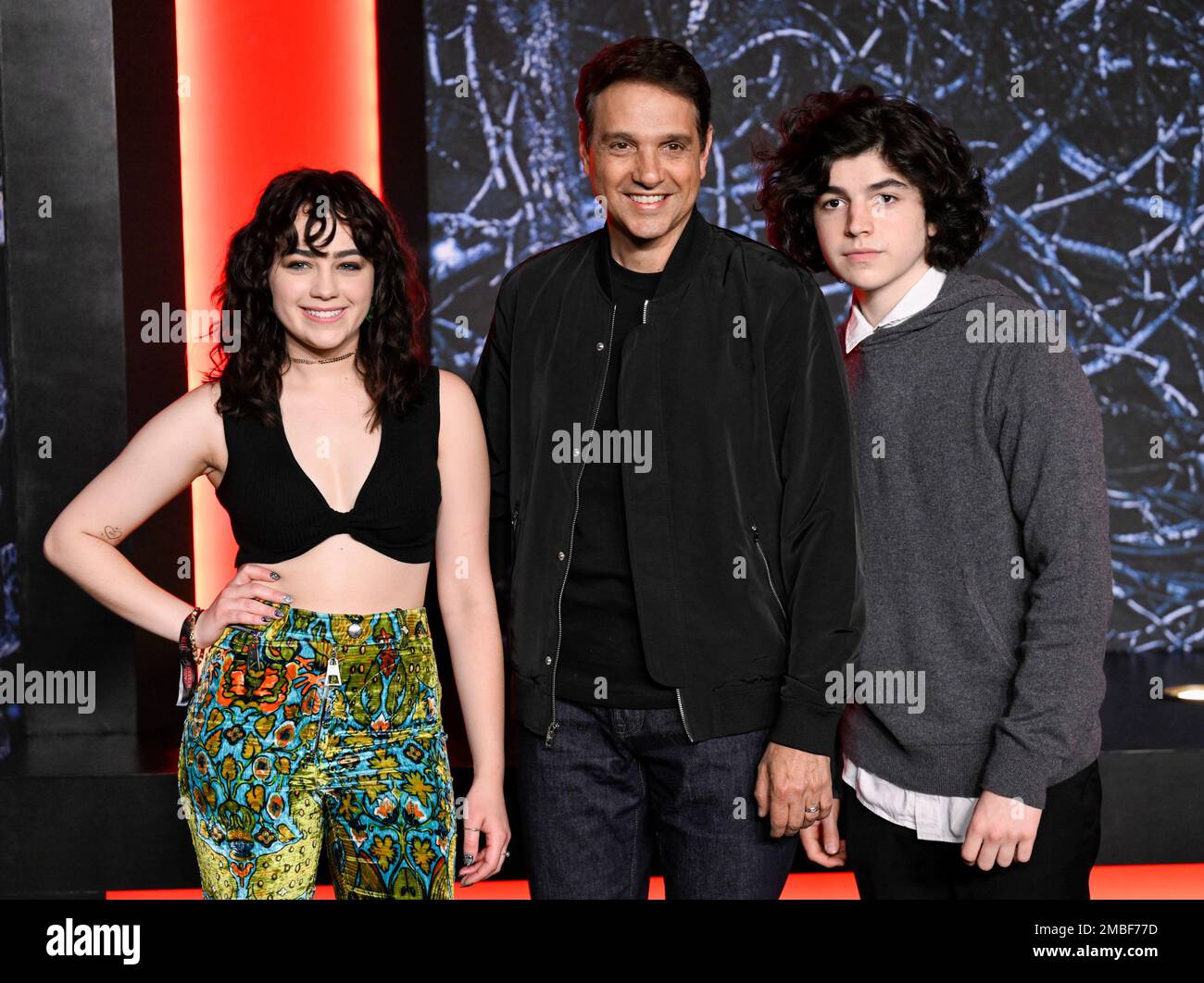 Mary Mouser, left, and Ralph Macchio and Griffin Santopietro attend the premiere of "Stranger ...