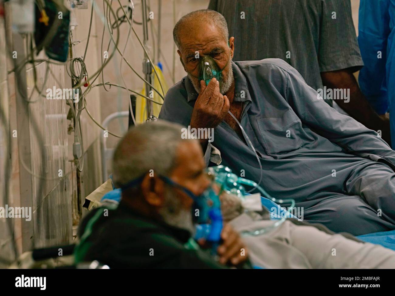 People with breathing problems are treated at a hospital during a ...