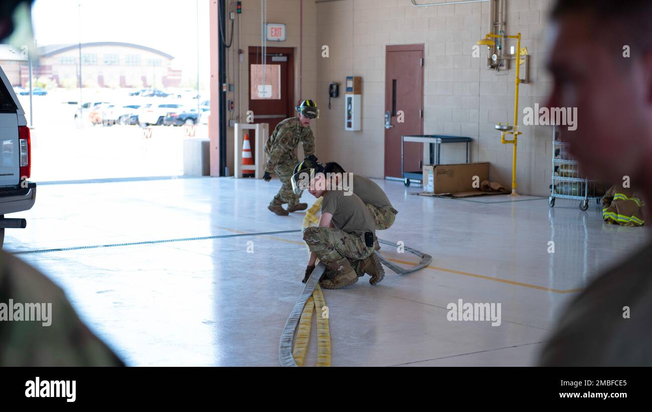 Airmen from the 49th Civil Engineer Squadron lay 50 feet of attack line ...