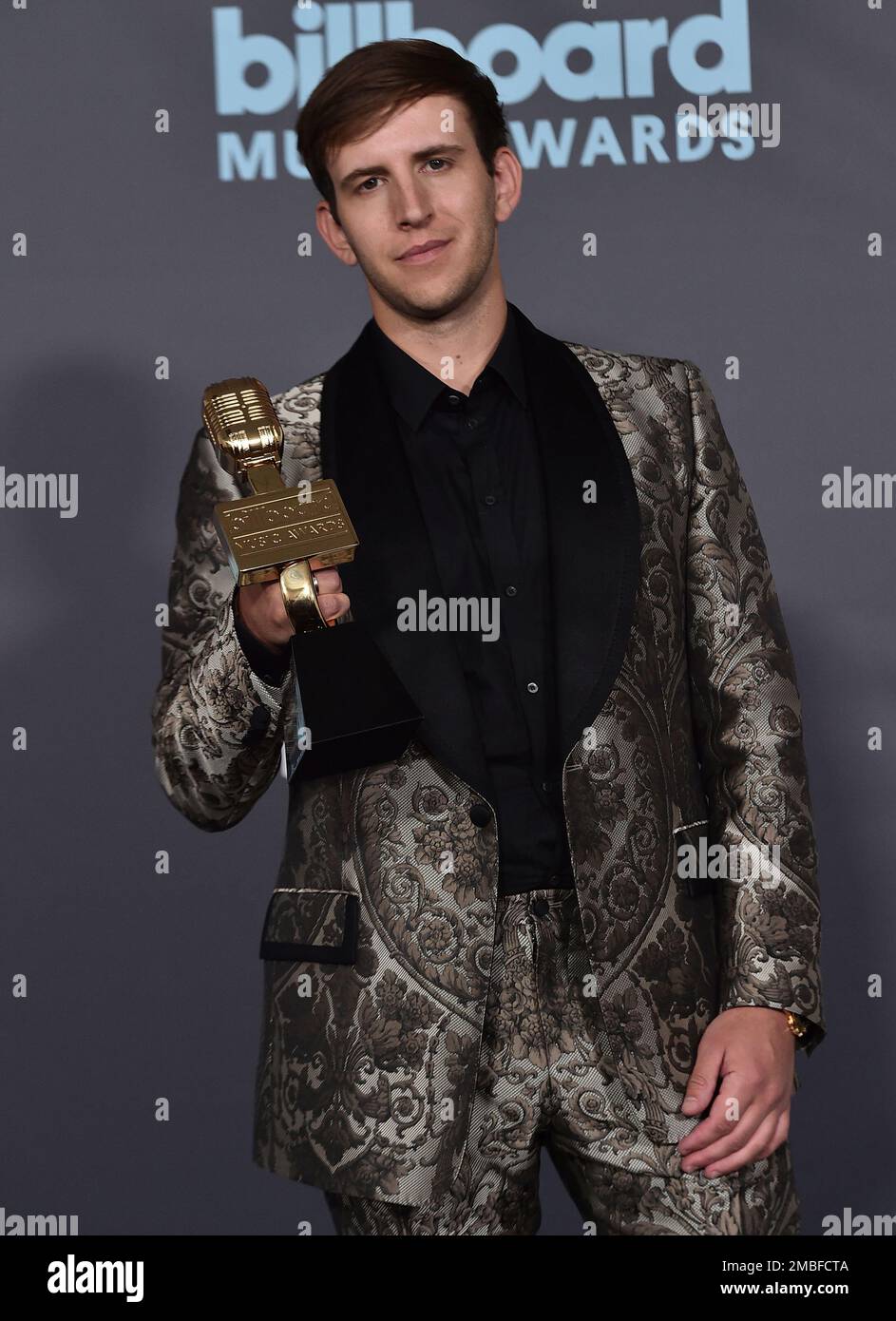 Illenium poses in the press room with the award for Top Dance ...