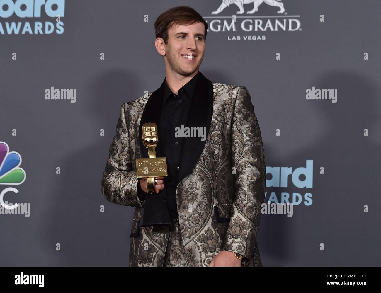 Illenium poses in the press room with the award for Top Dance ...