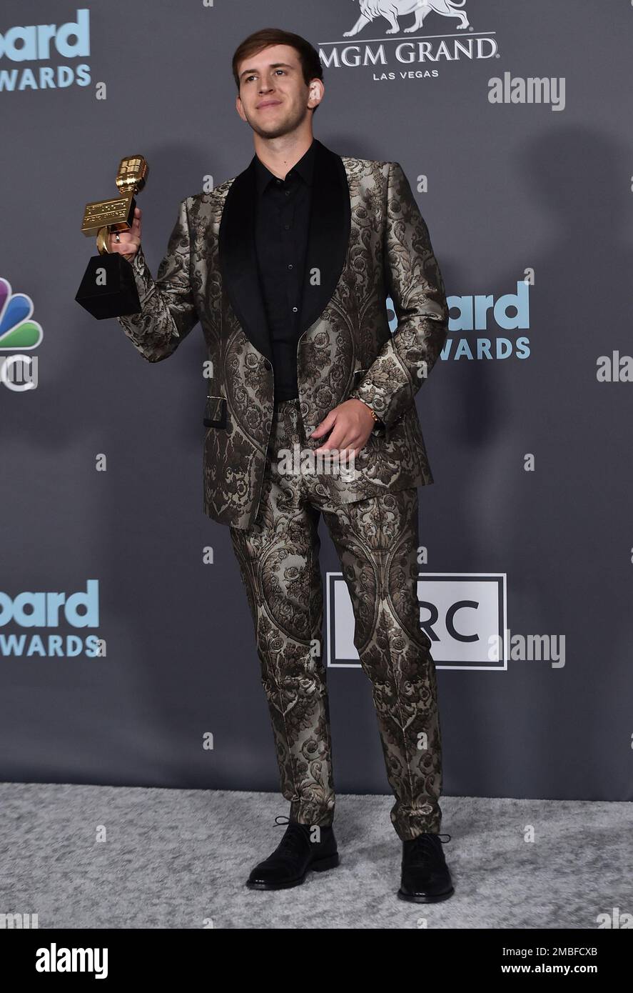 Illenium poses in the press room with the award for Top Dance ...
