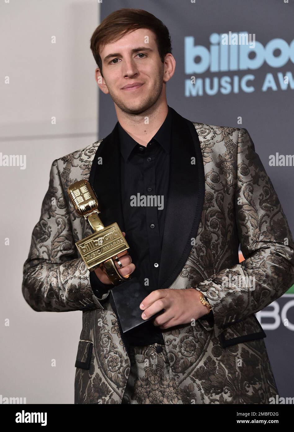 Illenium poses in the press room with the award for Top Dance ...