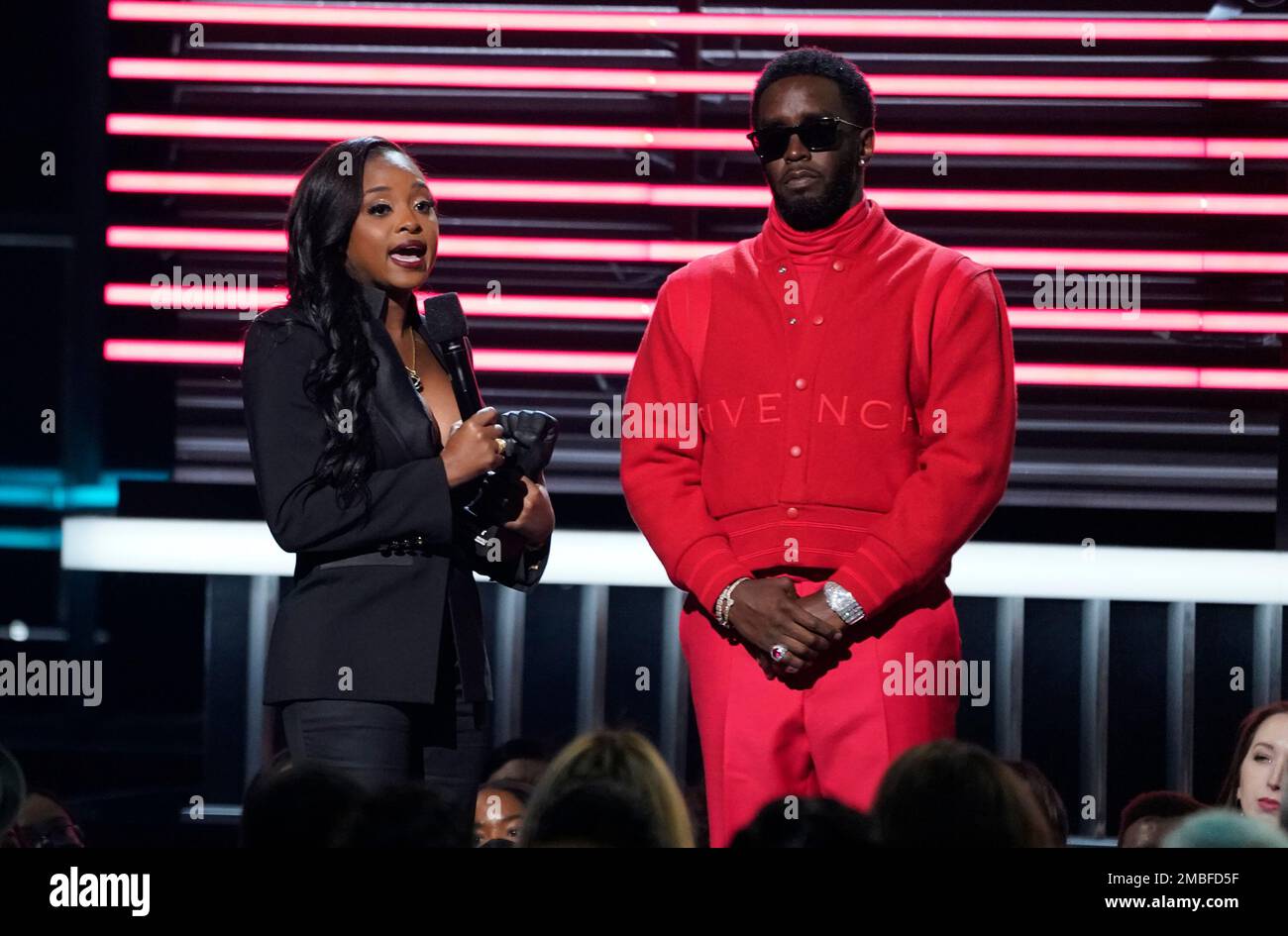 Sean "Diddy" Combs, right, presents the revolt black excellence award ...