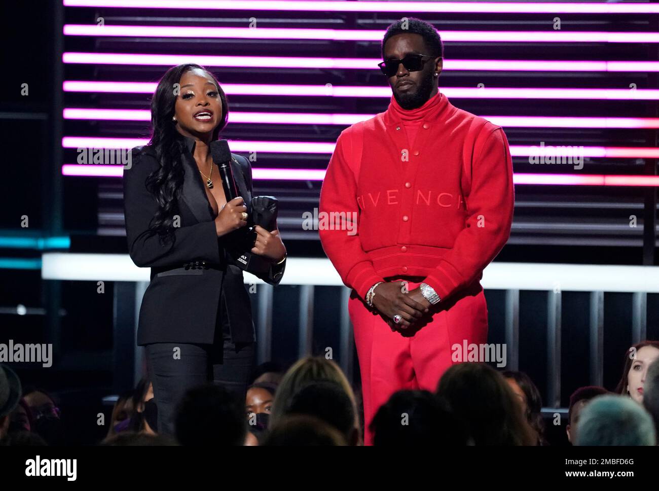 Sean "Diddy" Combs, right, presents the revolt black excellence award ...