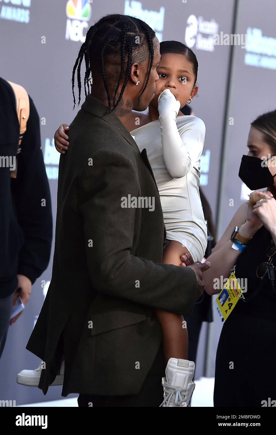 Travis Scott, left, and daughter Stormi Webster arrive at the Billboard ...
