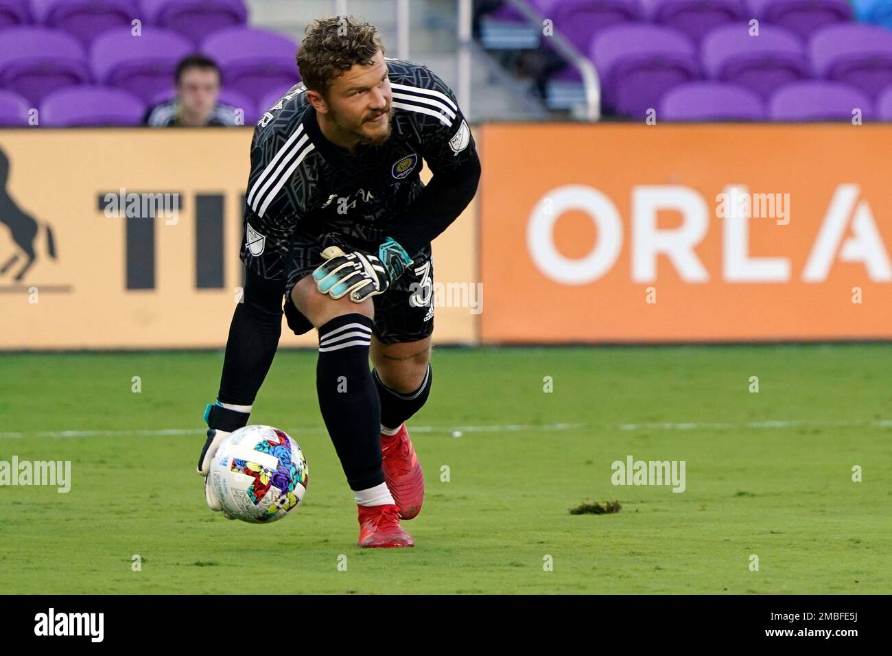 Orlando City goalkeeper Mason Stajduhar clears the ball from his goal ...