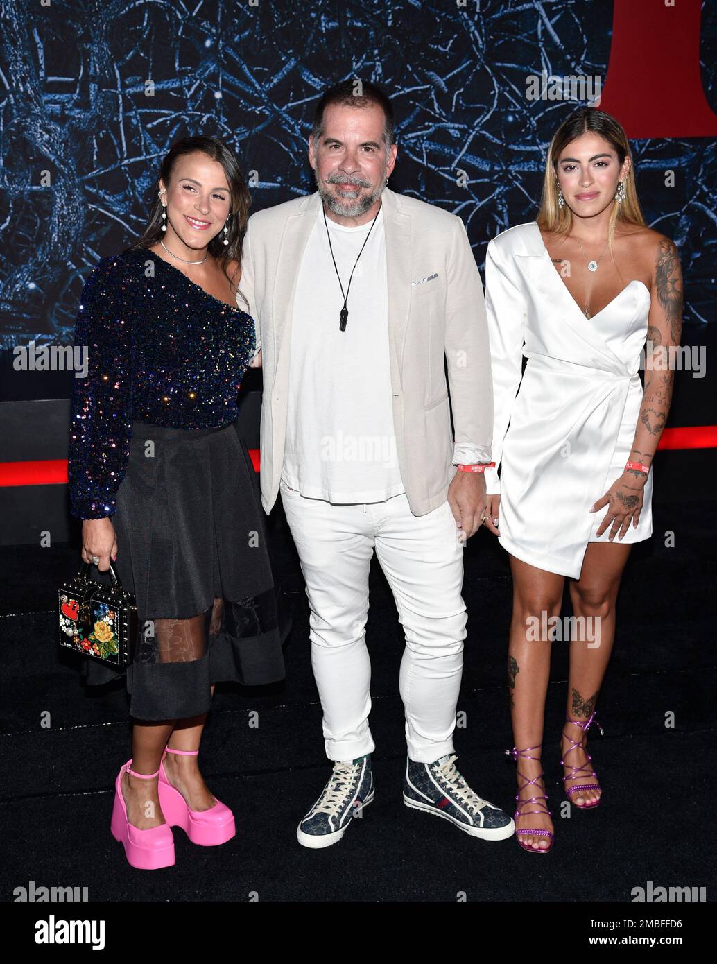 Leandro Hassum Moreira, center, and guests attend the premiere of ...