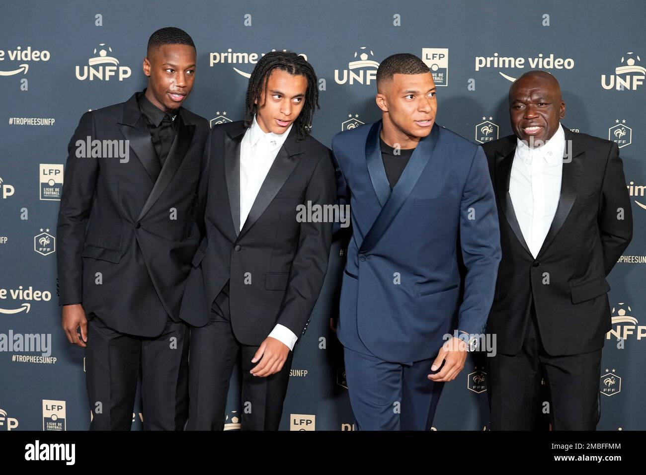 Paris Saint Germain's Kylian Mbappe, 2nd right, poses with his his ...