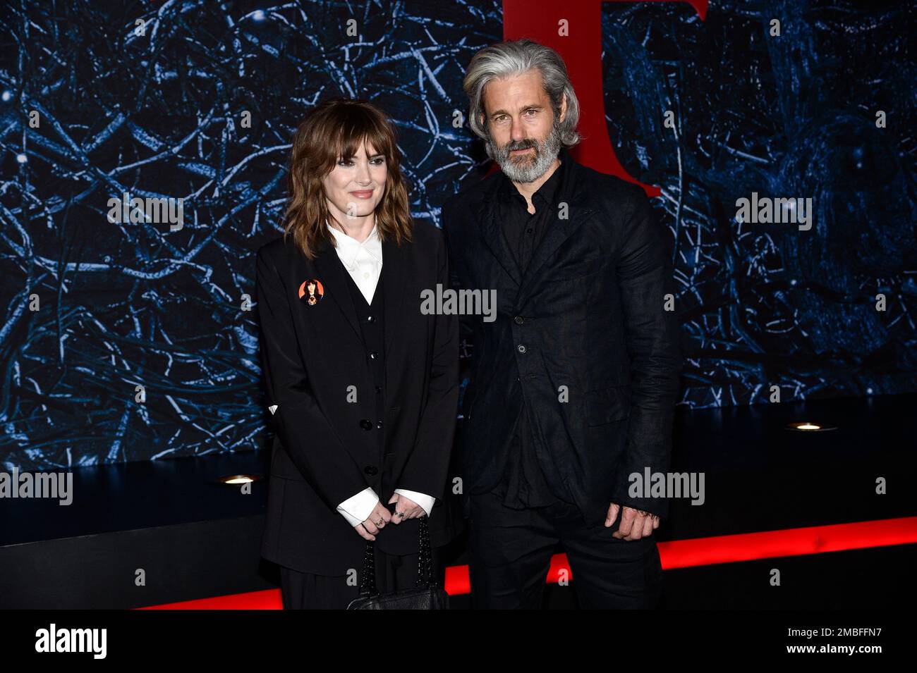 Winona Ryder, left, and husband Scott Mackinlay Hahn attend the ...