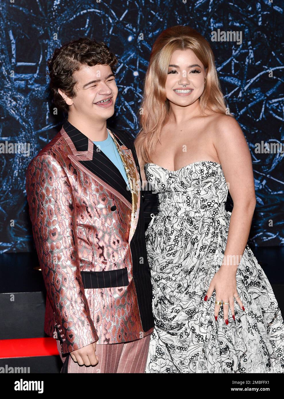 Gaten Matarazzo, left, and girlfriend Elizabeth Yu attend the premiere ...