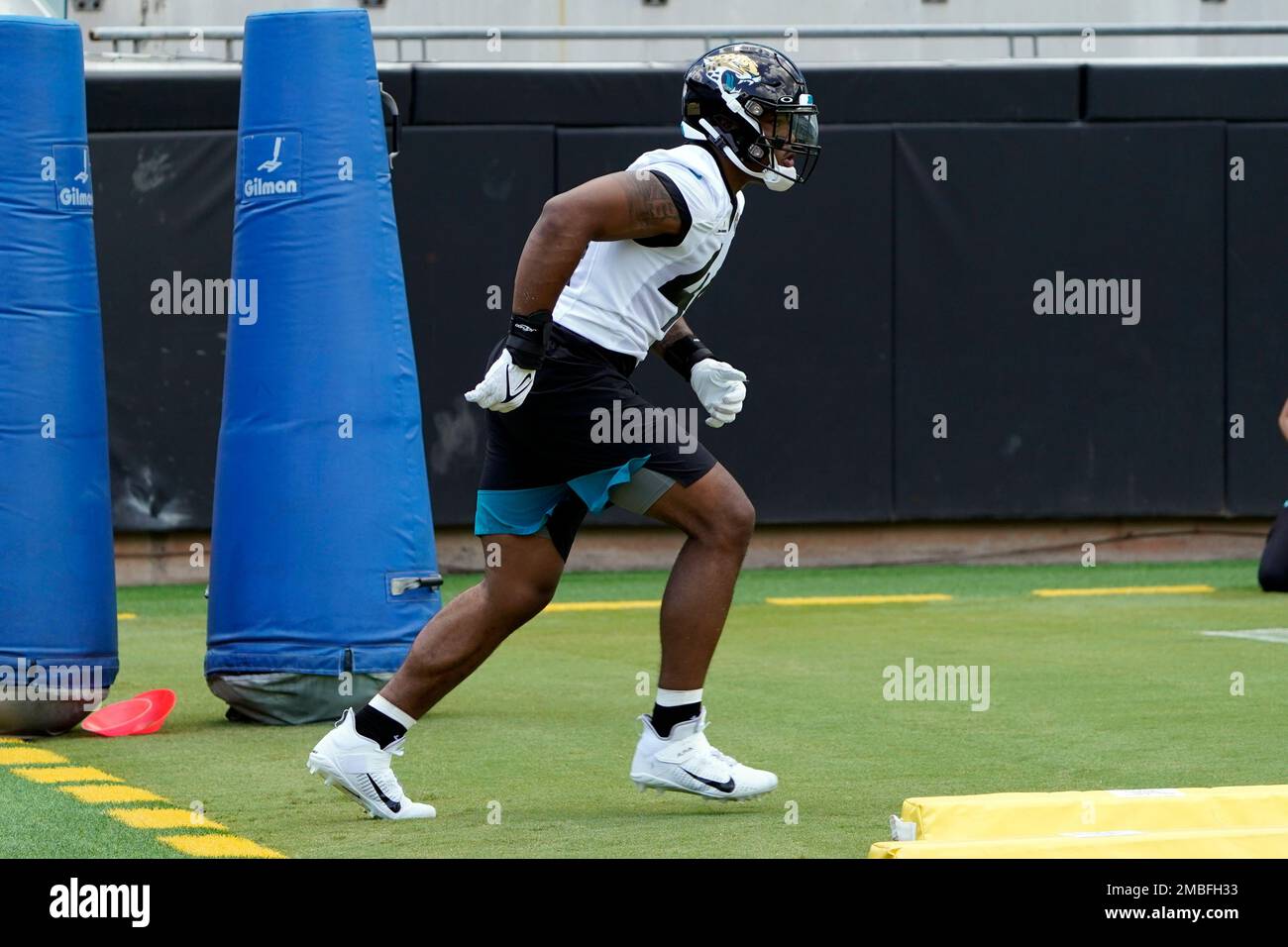 Jacksonville Jaguars outside linebacker Travon Walker (44) performs a ...