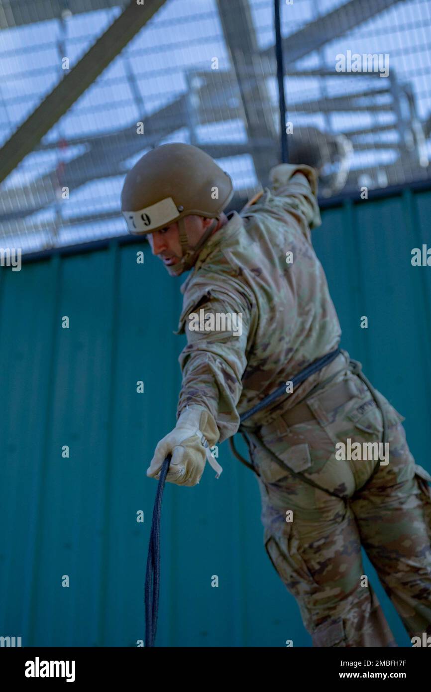 Spc. Ryan Ortwein from 11th Airborne Division rappels off the training ...