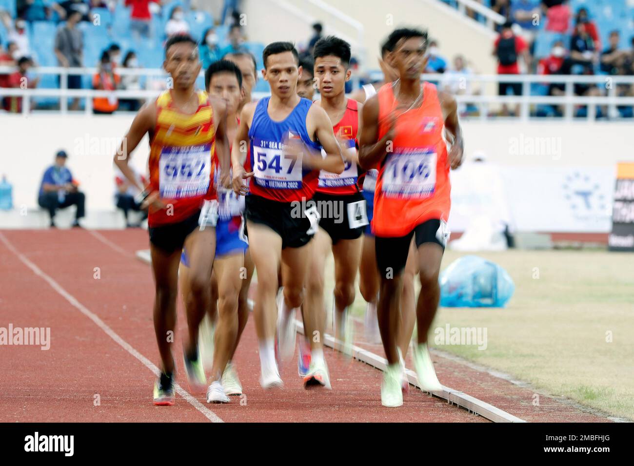 Athletes in action during the men's 5000M run in the Athletics ...