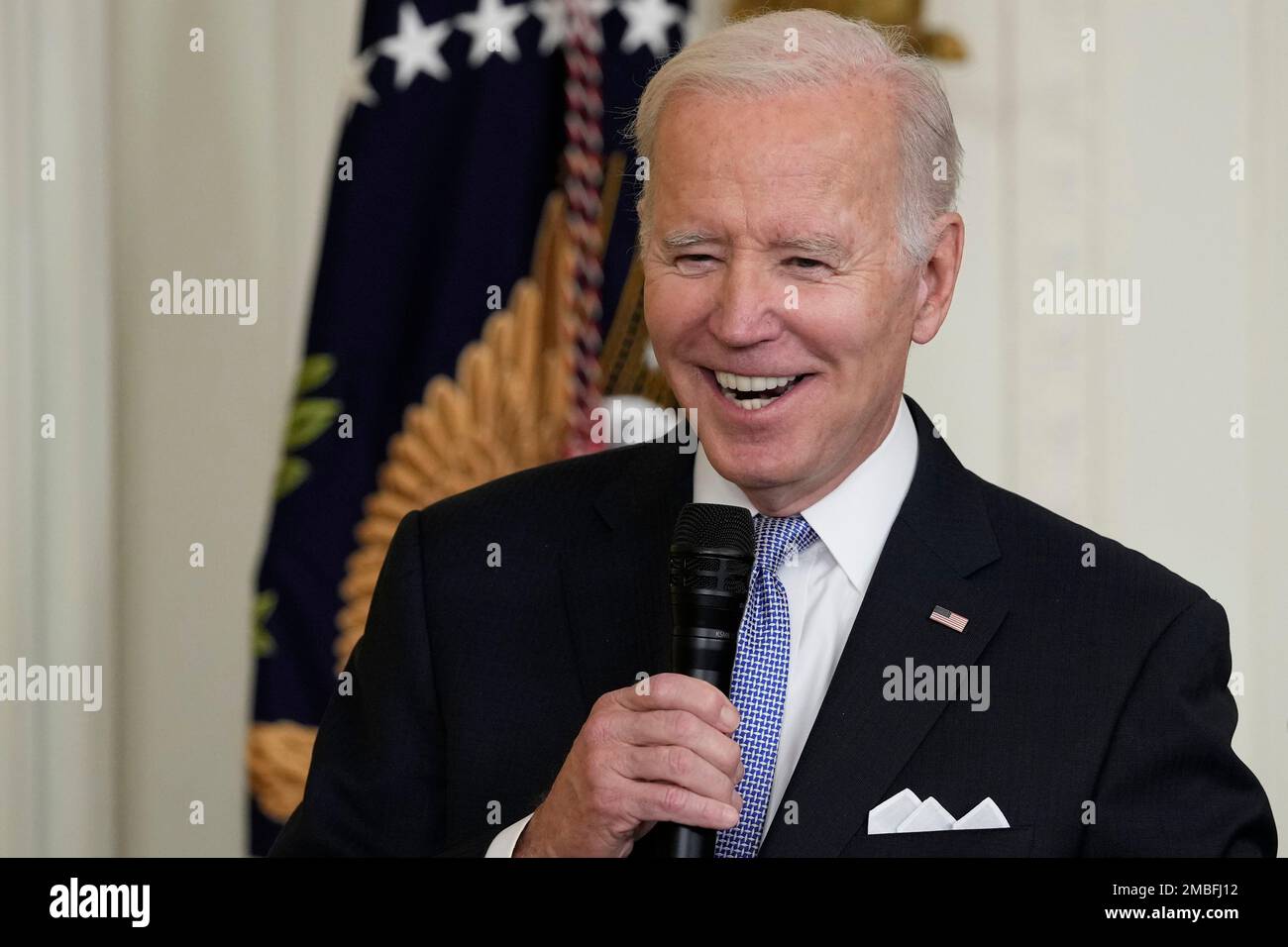 President Joe Biden speaks in the East Room of the White House to ...