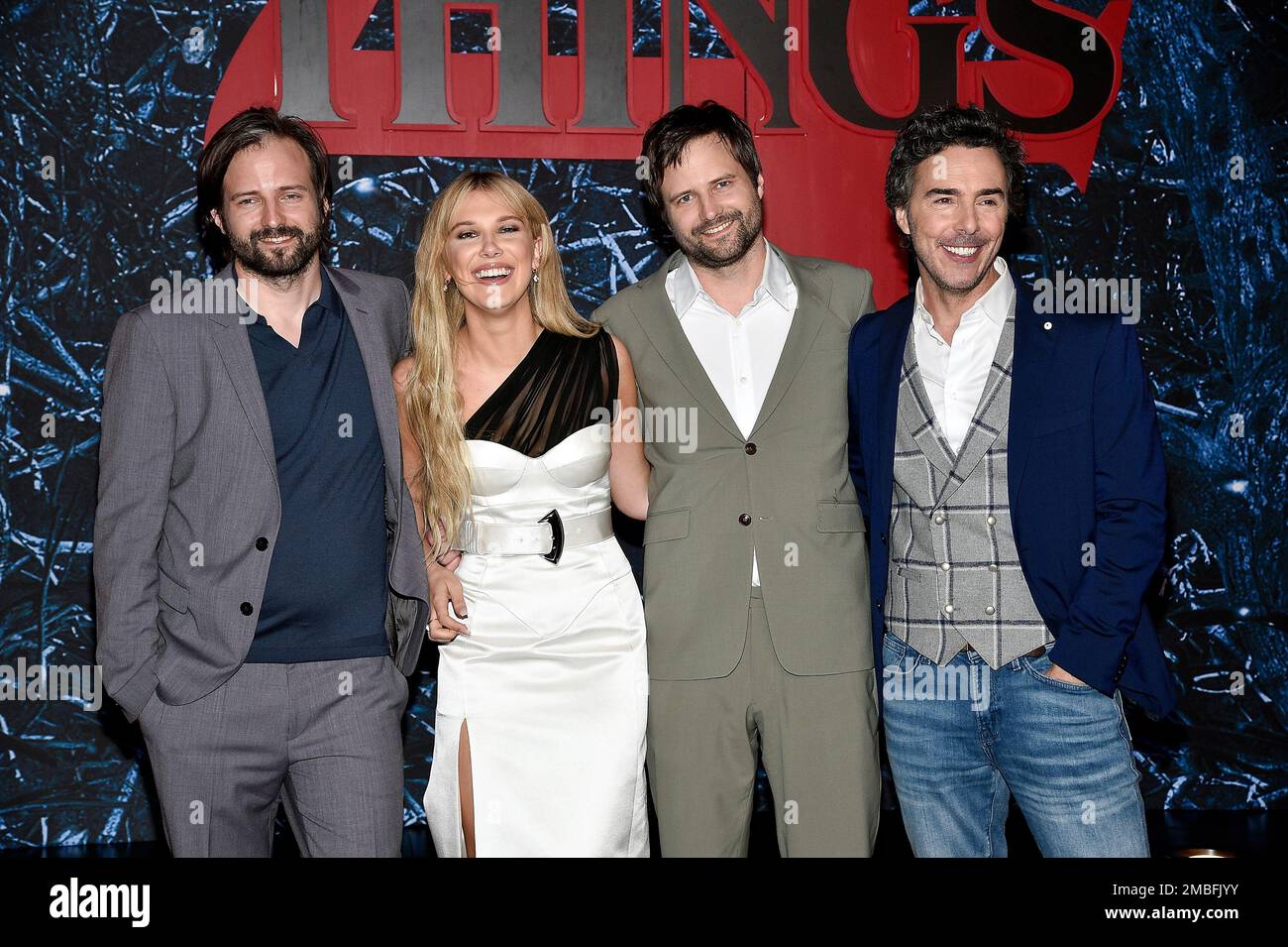 Millie Bobby Brown, center, poses with executive producer/directors ...