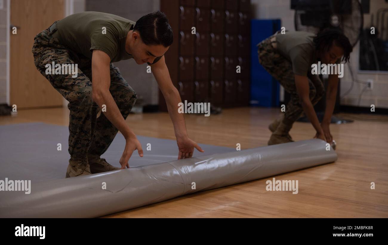 U.S. Marine Corps Cpl. Everett Radcliffe, left, a combat graphics ...