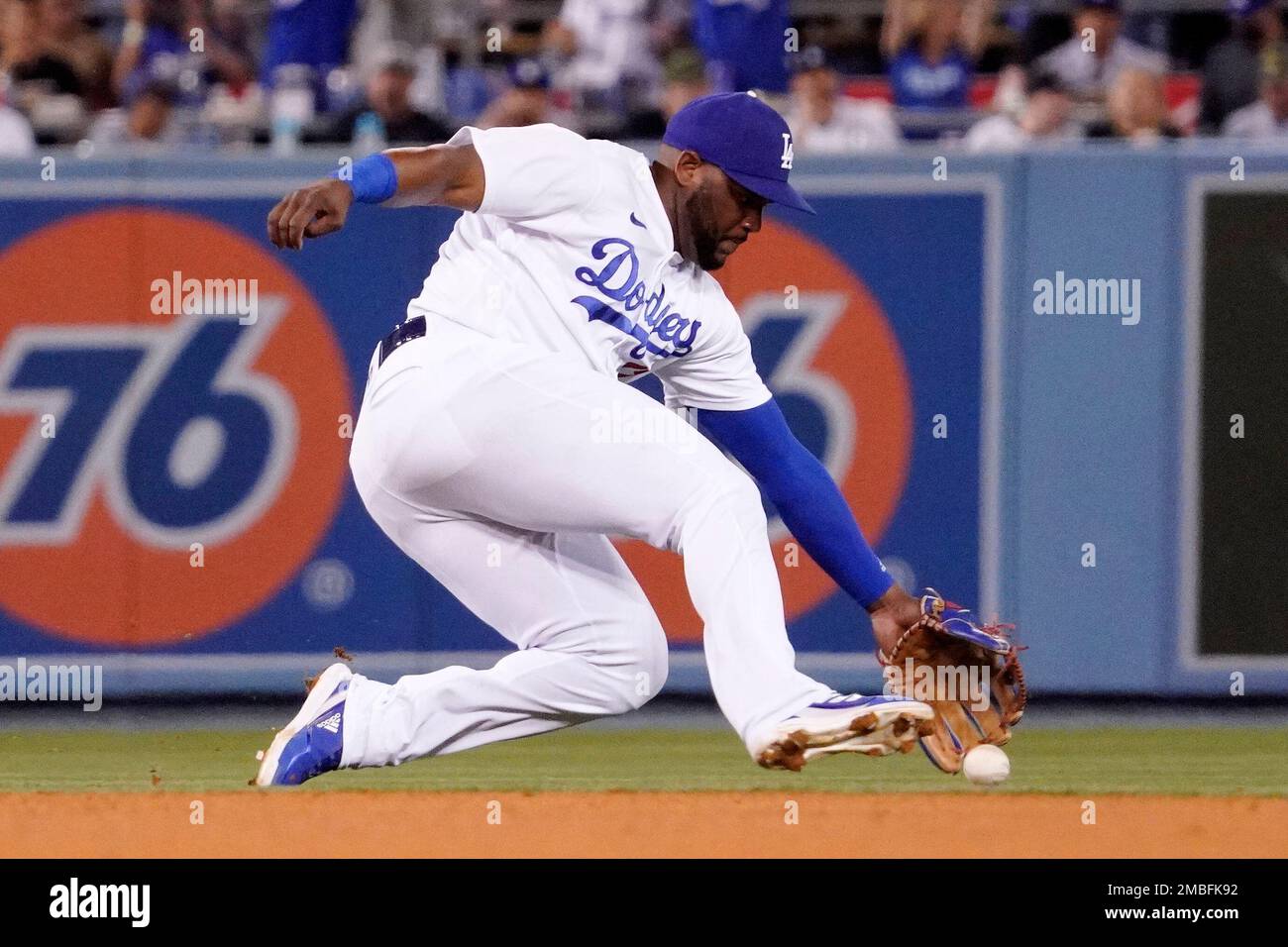 Los Angeles Dodgers second baseman Hanser Alberto can't get to a ball hit for a single by ...