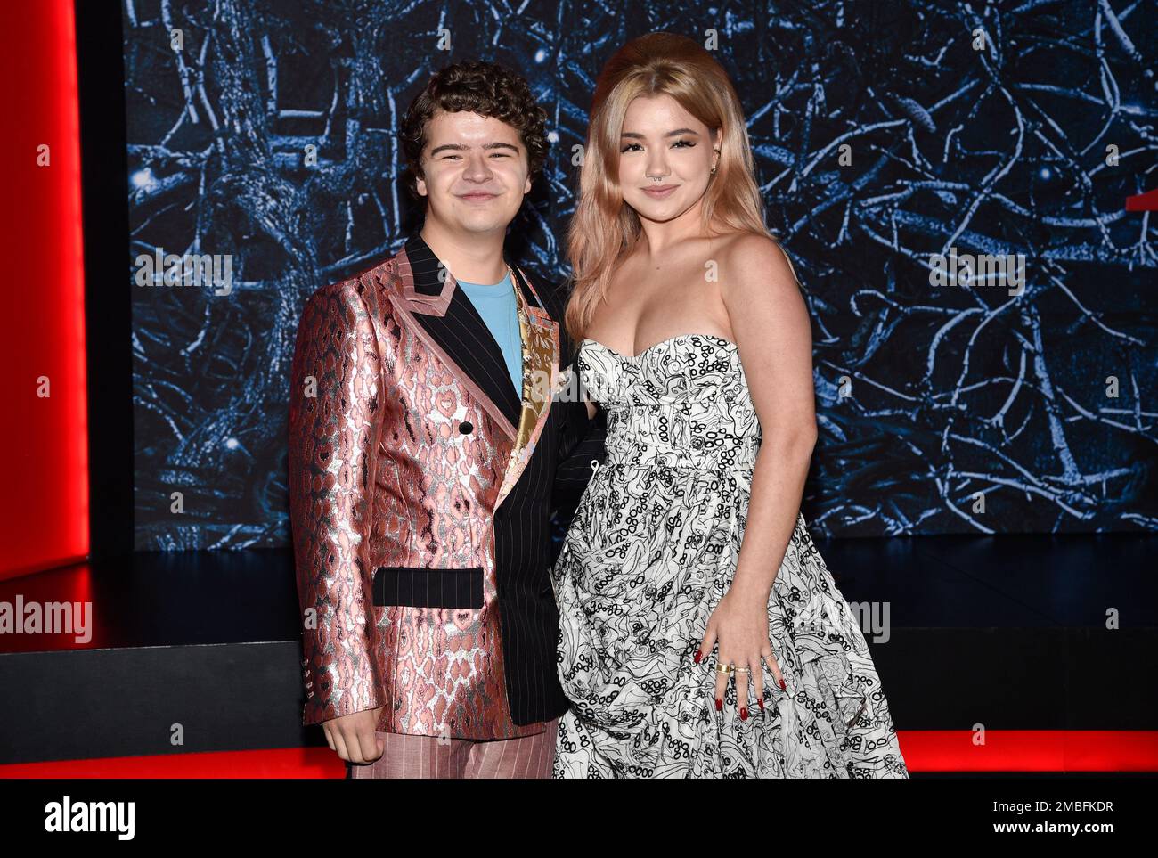 Gaten Matarazzo, left, and girlfriend Elizabeth Yu attend the premiere ...