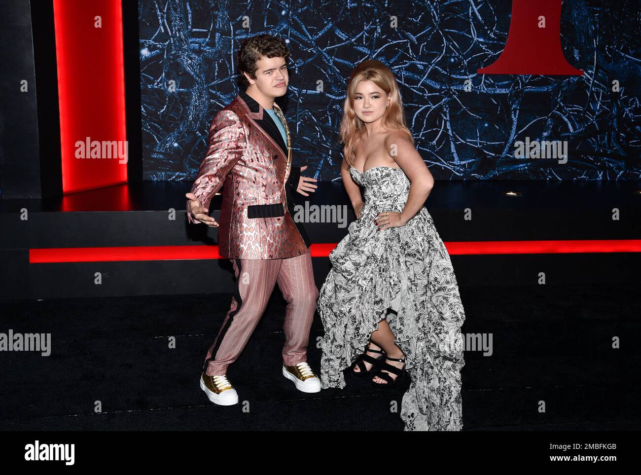 Gaten Matarazzo, left, and girlfriend Elizabeth Yu attend the premiere ...