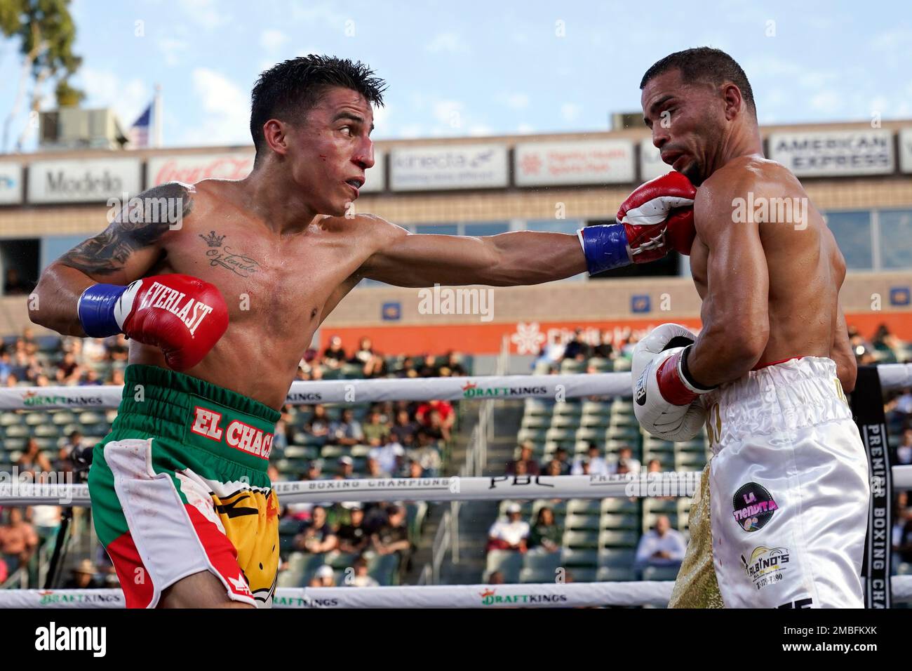 Kevin Gonzalez, left, and Emanuel Rivera fight during a super bantamweight boxing bout Saturday ...