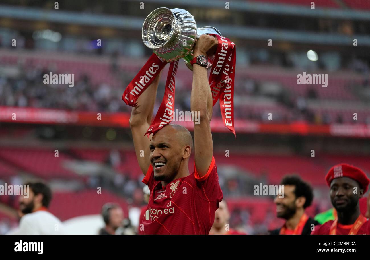 Liverpool's Fabinho lifts the trophy and celebrates after winning the ...